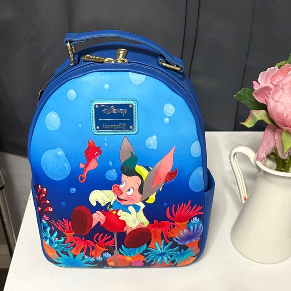 Loungefly | Bags | Loungefly Blue Disney Backpack With Pinocchio Design ...